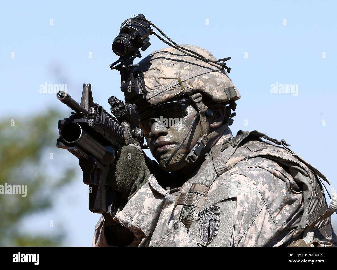 A U.S. Army Ranger demonstrates a gun used by the Rangers during a Amry ...