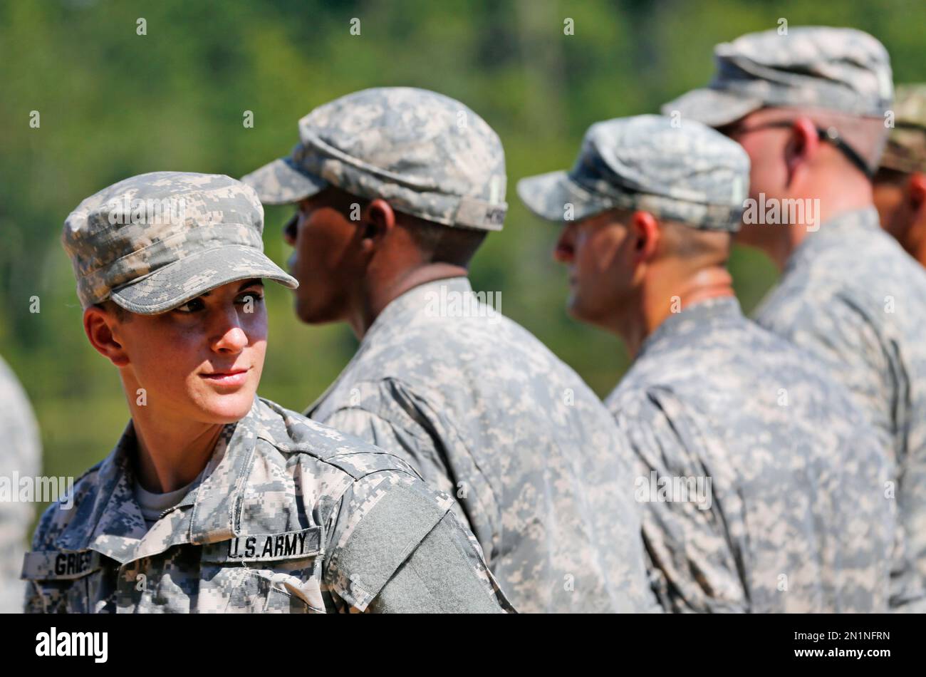 U.S. Army Capt. Kristen Griest, of Orange, Connecticut, left, smiles as ...