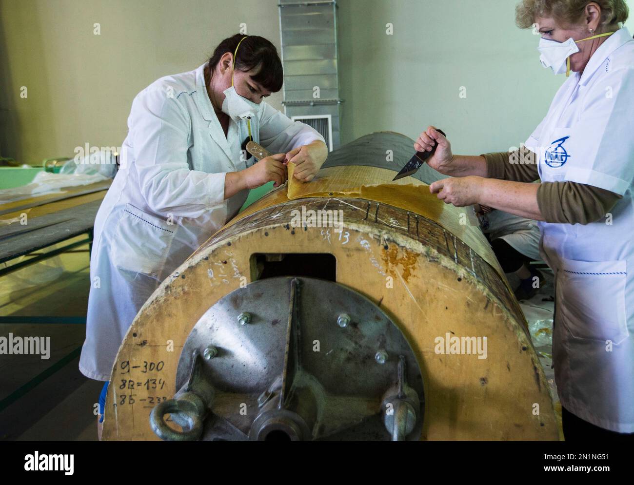 Factory workers assemble MiG-29 fighter jets at the Russian Corporation MiG factory in ...