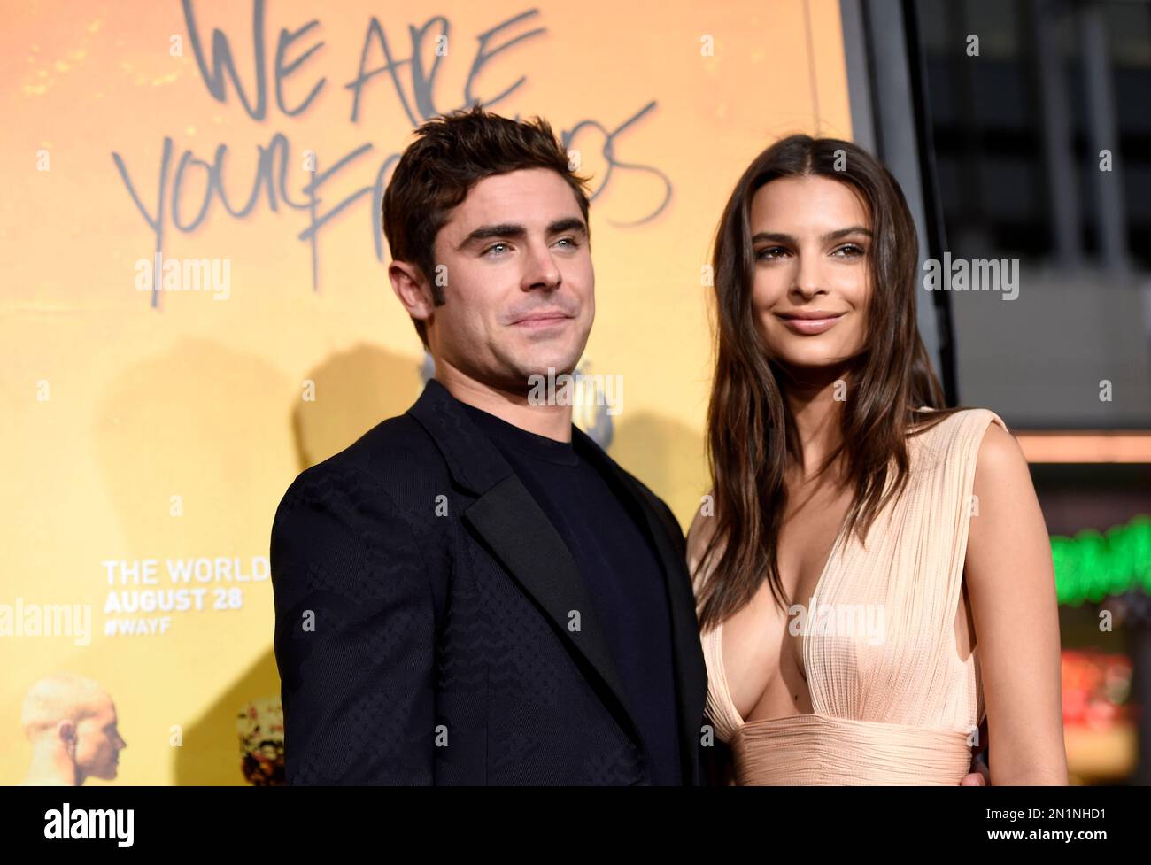 Zac Efron, left, and Emily Ratajkowski, cast members in "We Are Your ...