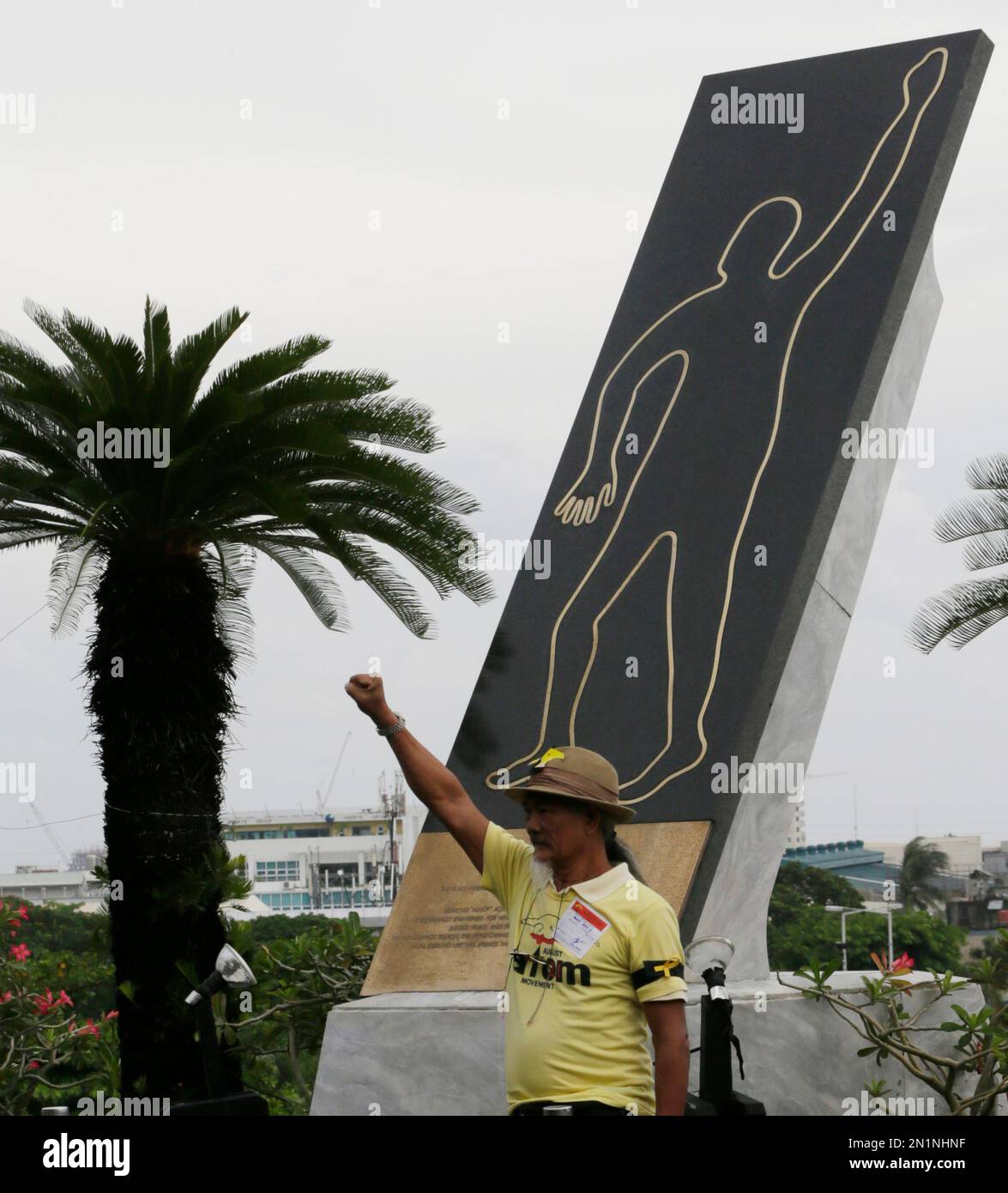 A supporter raised his clenched fist as he poses for a souvenir shot at ...