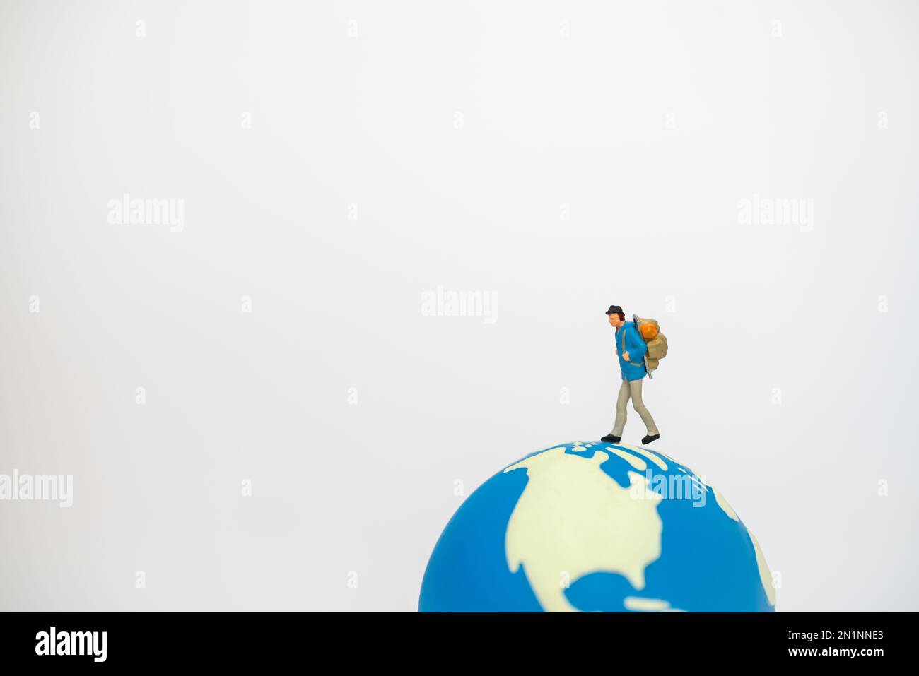 Travel Concept. Traveler miniature figure people with backpack walking ...