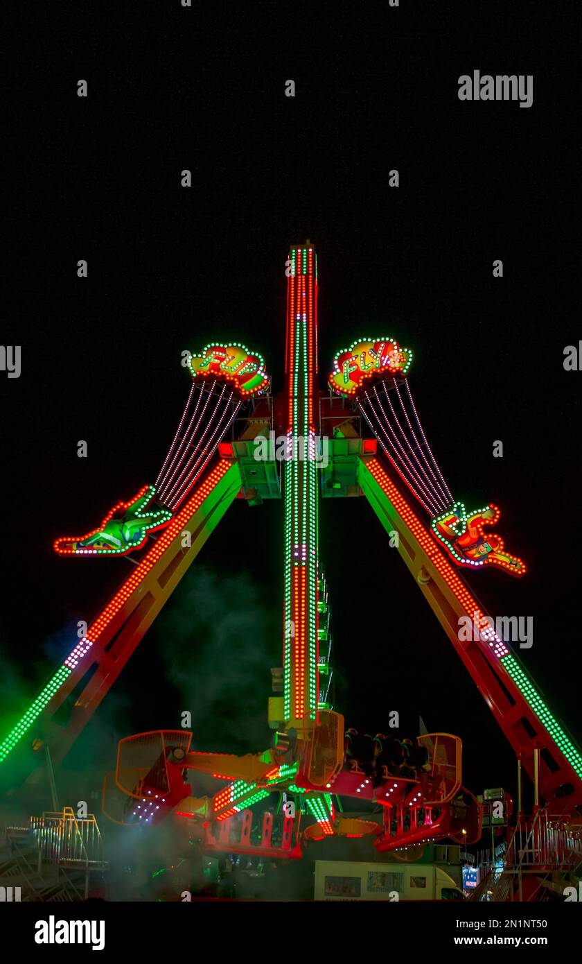 shot from below of illuminated fairground ride Stock Photo - Alamy