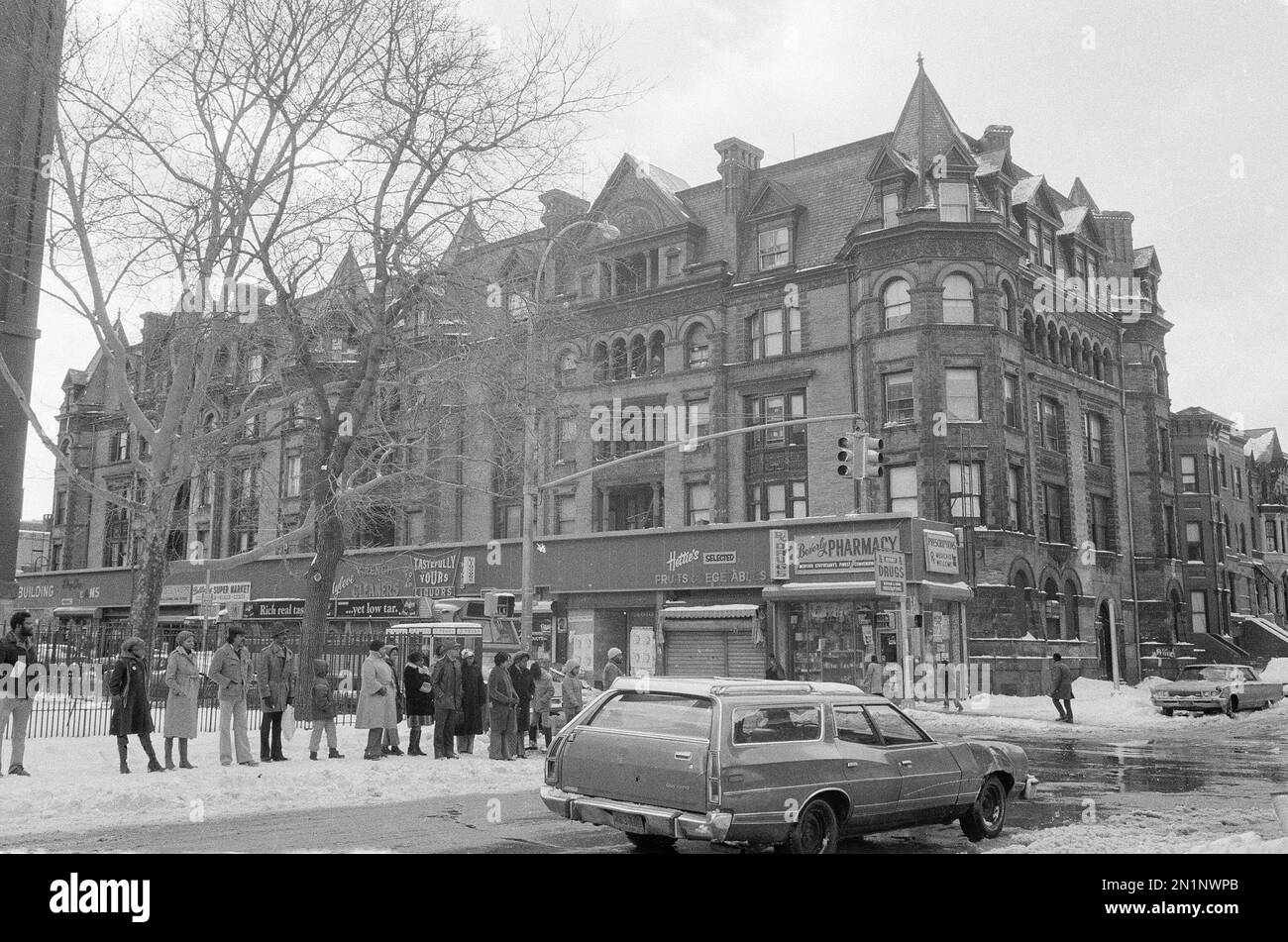 People wait for a bus in the Bedford-Stuyvesant section of Brooklyn ...