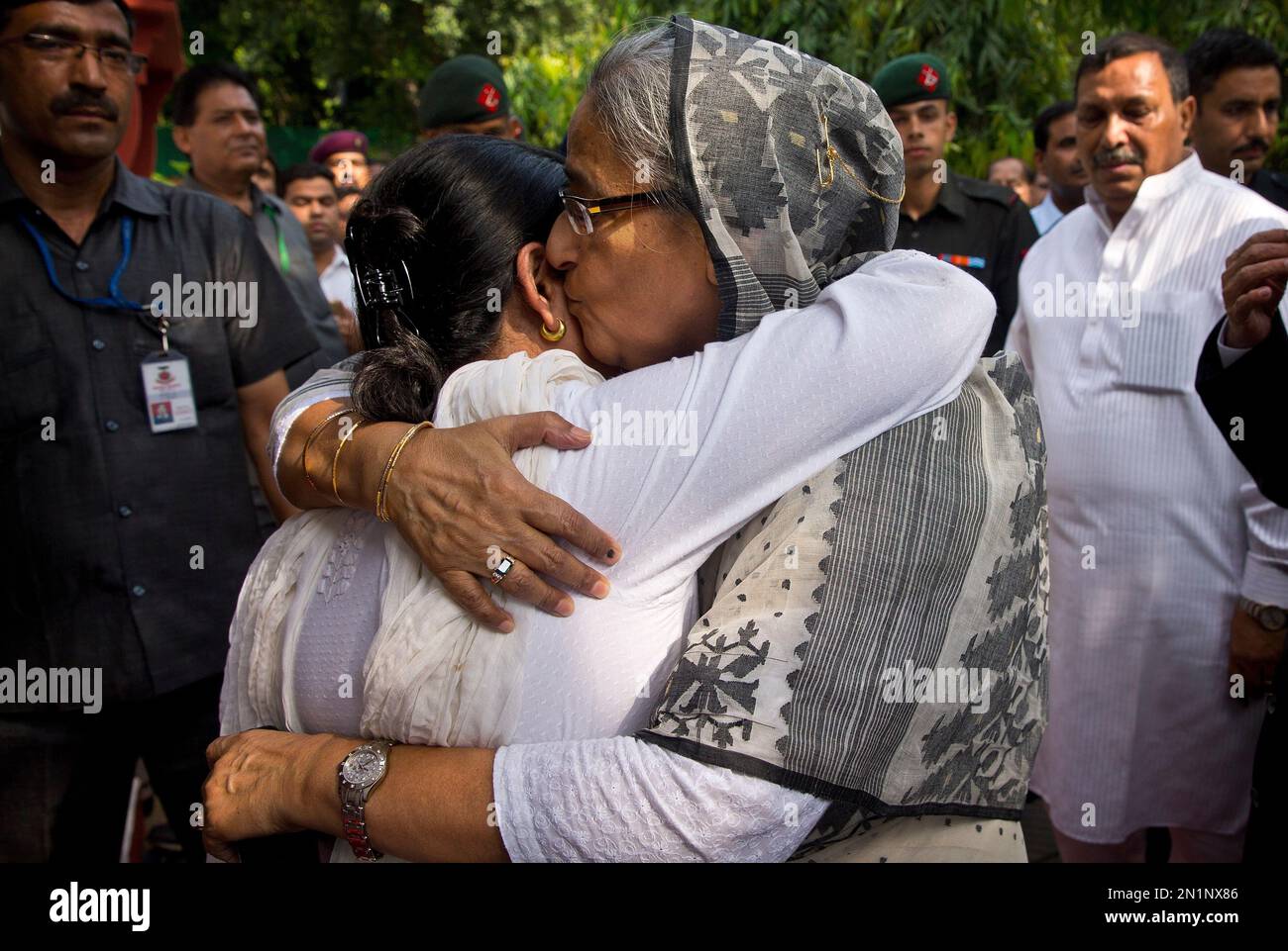 Bangladesh’s Prime Minister Sheikh Hasina, right, embraces Sharmistha Mukherjee, daughter of ...