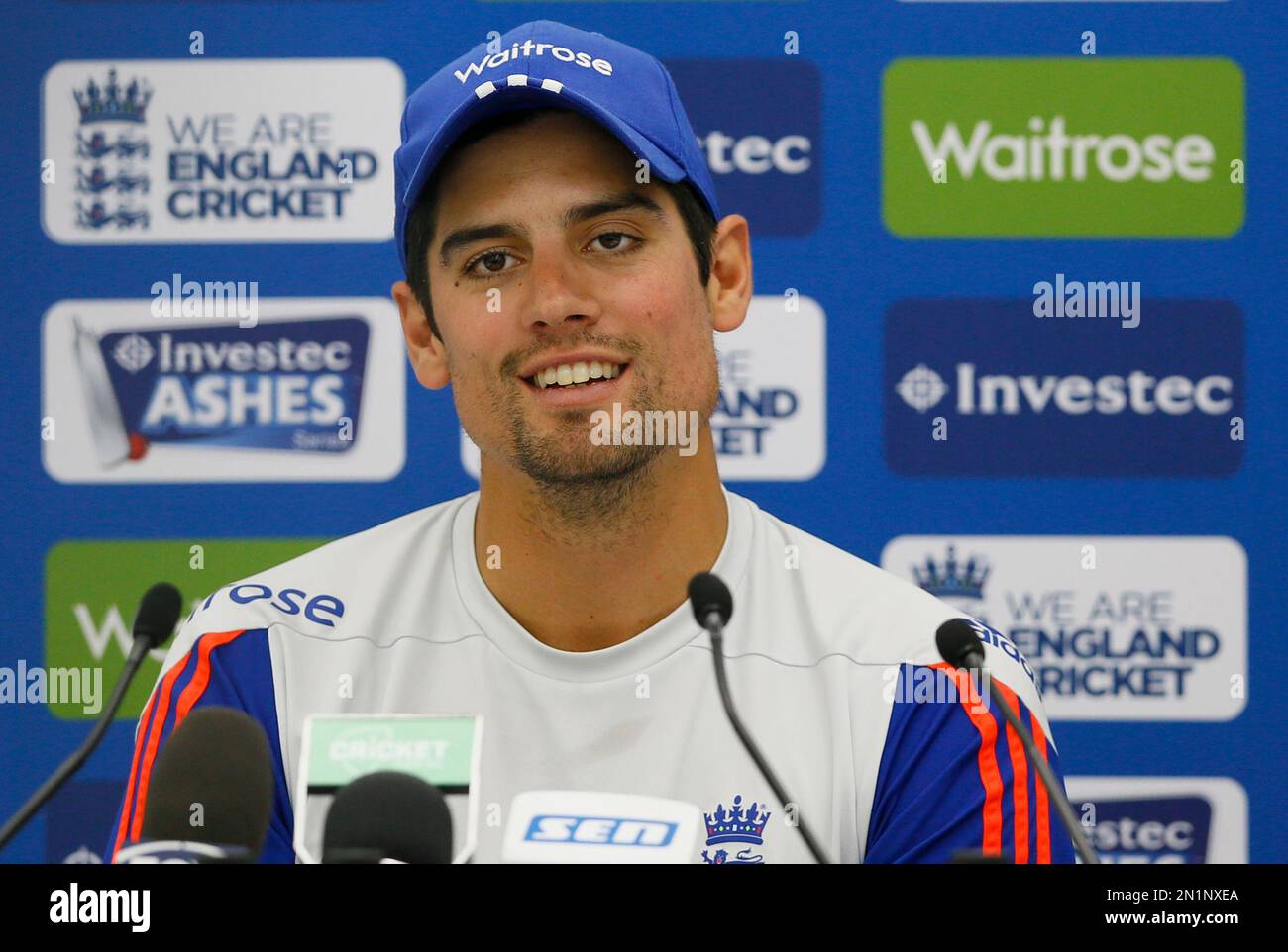 England's captain Alastair Cook smiles during a press conference at the ...