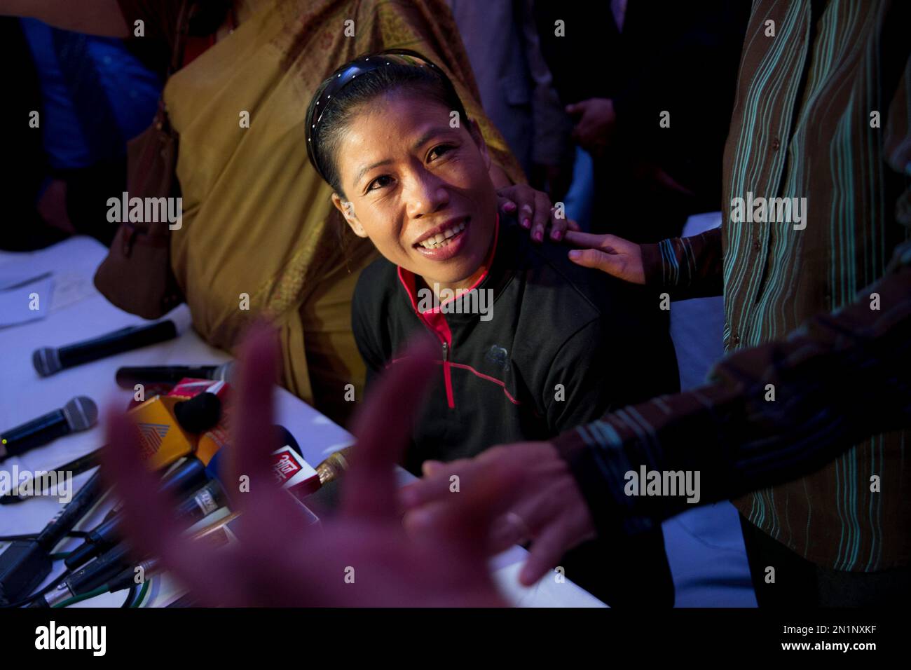 Indian boxer Mary Kom gestures as she interacts with the media at an ...