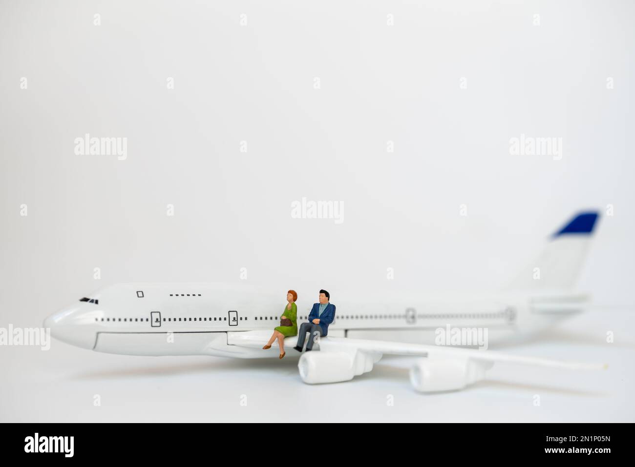Business and Travel Concept. Businessman and businesswoman miniature ...