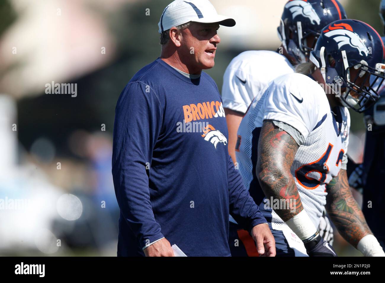 Denver Broncos offensive line coach Clancy Barone during the morning ...