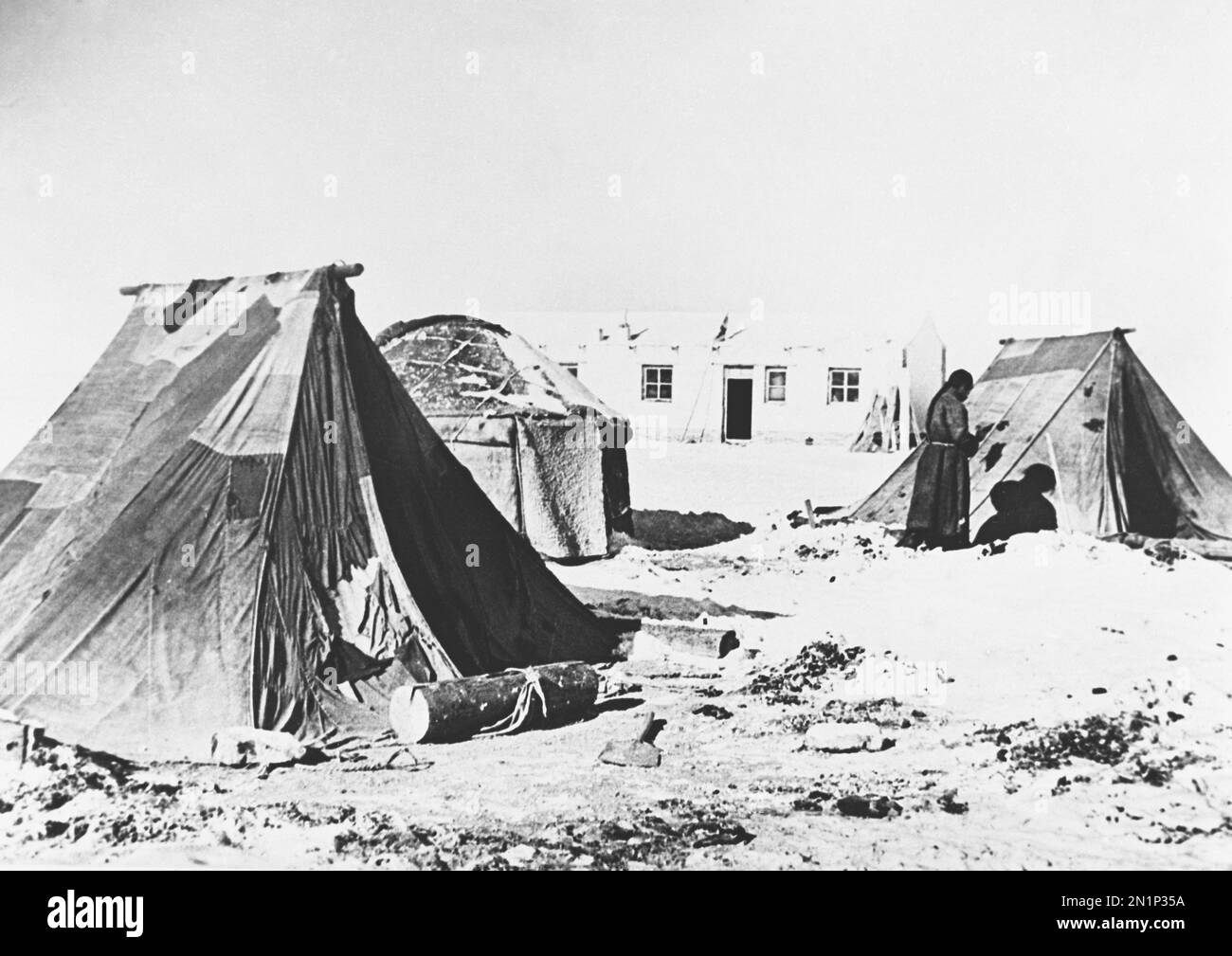 Sick Mongols are tended to inside hospital tents in a town in Chahar ...