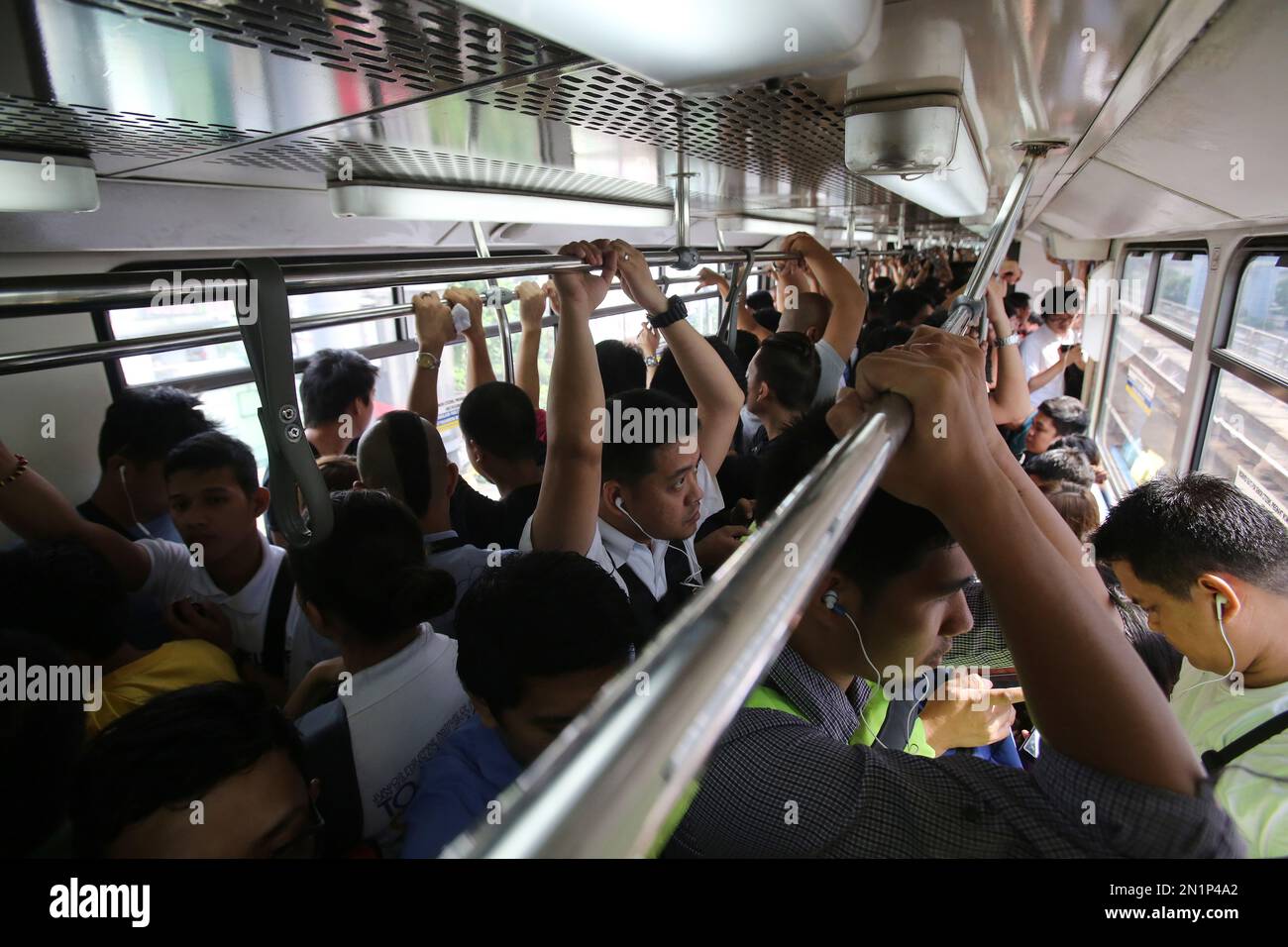 In this Tuesday, Aug. 11, 2015 photo, Filipino passengers ride a ...
