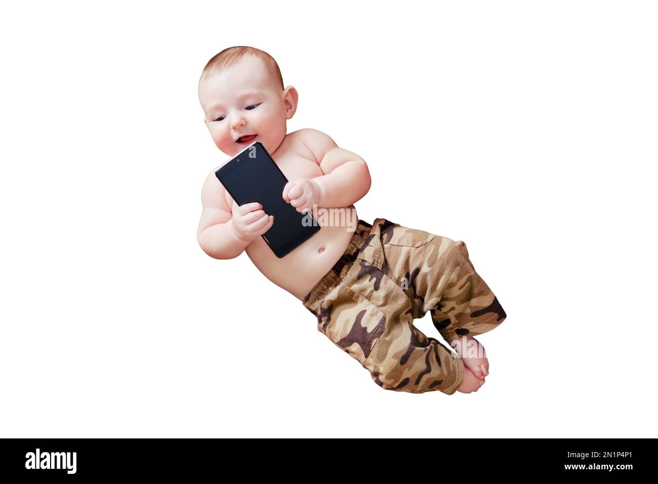 Funny happy baby boy with a phone in his hands. Smiling child holds a ...