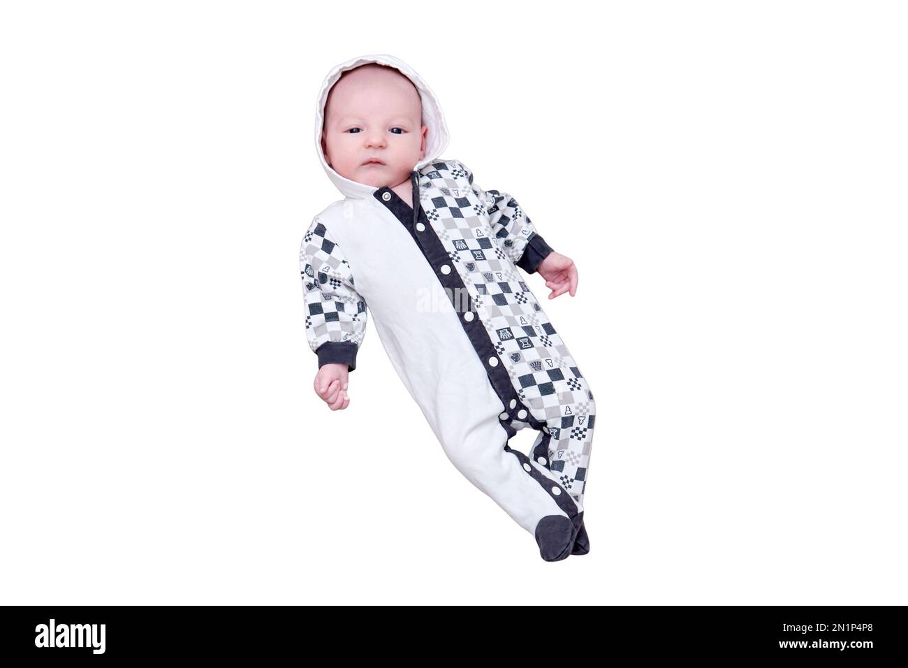 Newborn baby boy in a chess suit near a chessboard with placed pieces ...