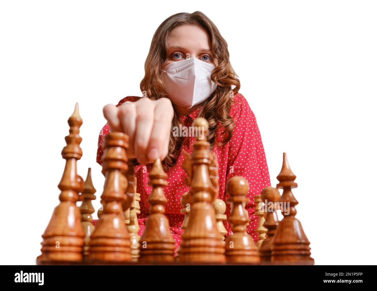 An adult woman plays chess while sitting in a respirator at a ...