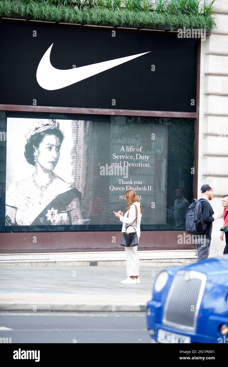A portrait of Queen Elizabeth II is displayed in a shop window in ...