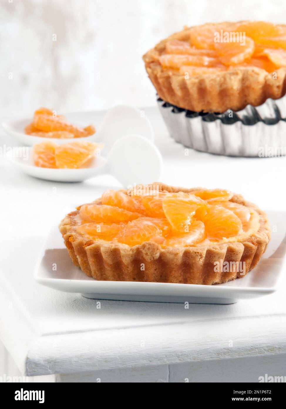 Mandarin tarts. Vertical caption Stock Photo - Alamy
