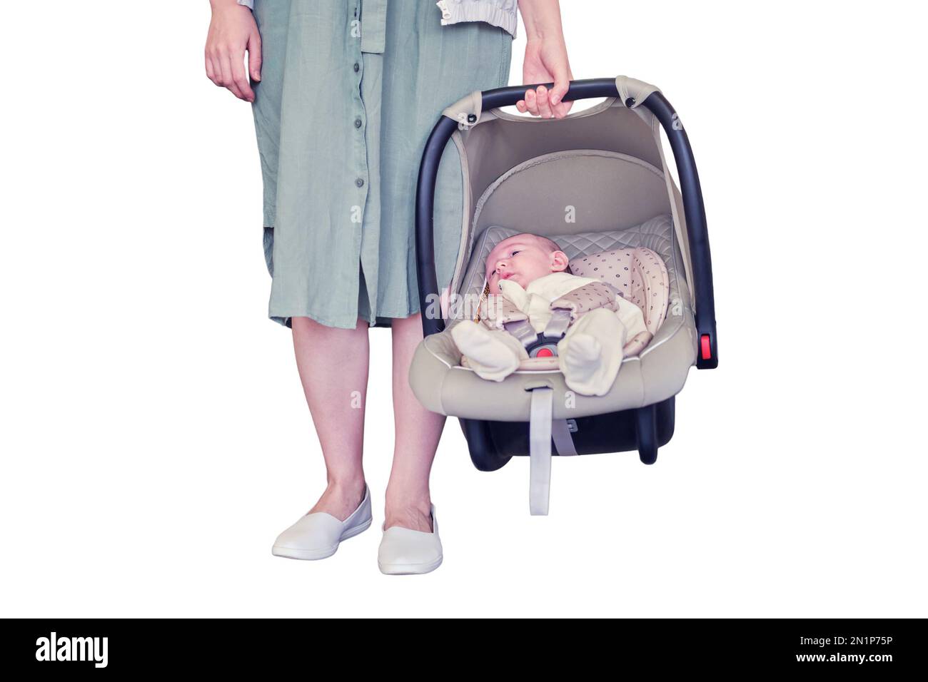 A mother with a newborn baby in a carrier, isolated on a white ...