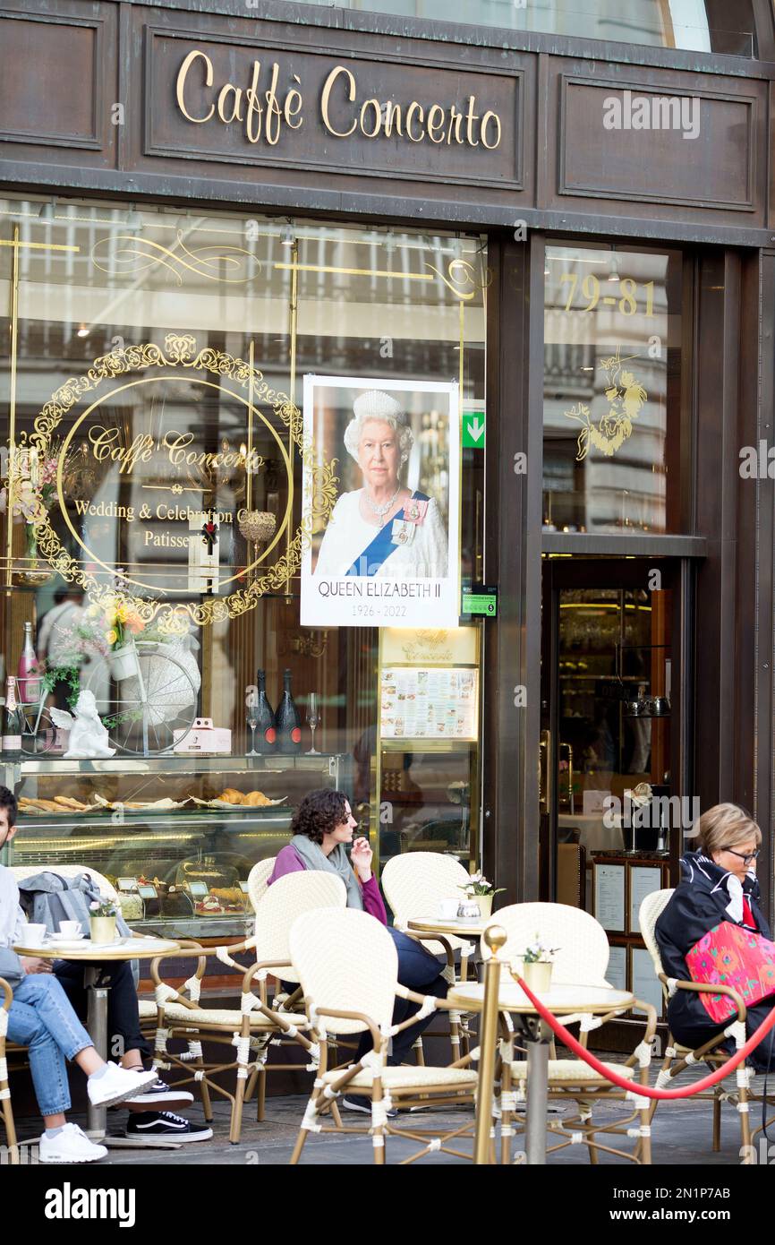 A portrait of Queen Elizabeth II is displayed in a shop window in ...