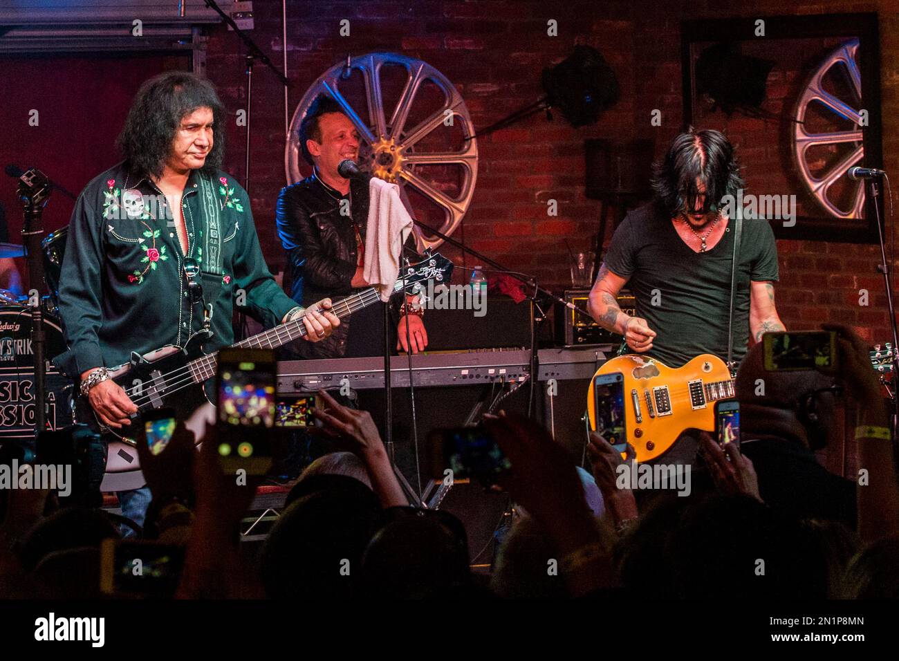 From left, Gene Simmons, Steve Ferlazzo and Gilby Clarke perform during ...