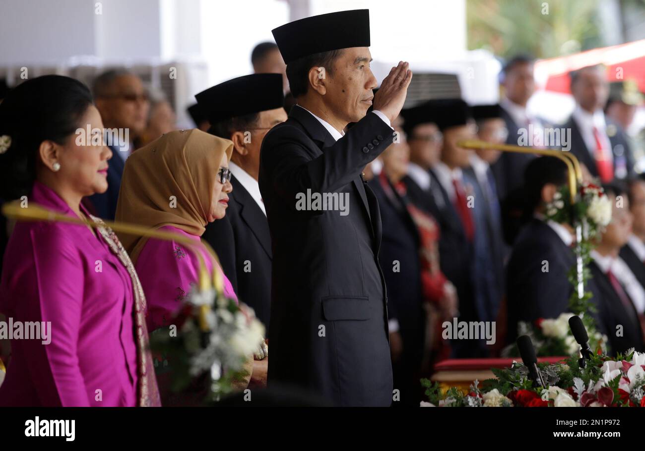 Indonesia's President Joko Widodo salutes during a flag raising ...