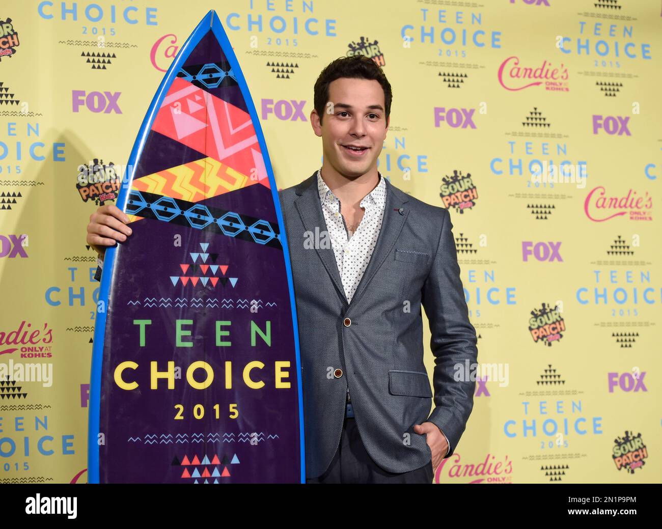 Skylar Astin, winner of the award for choice movie actor: comedy, poses ...