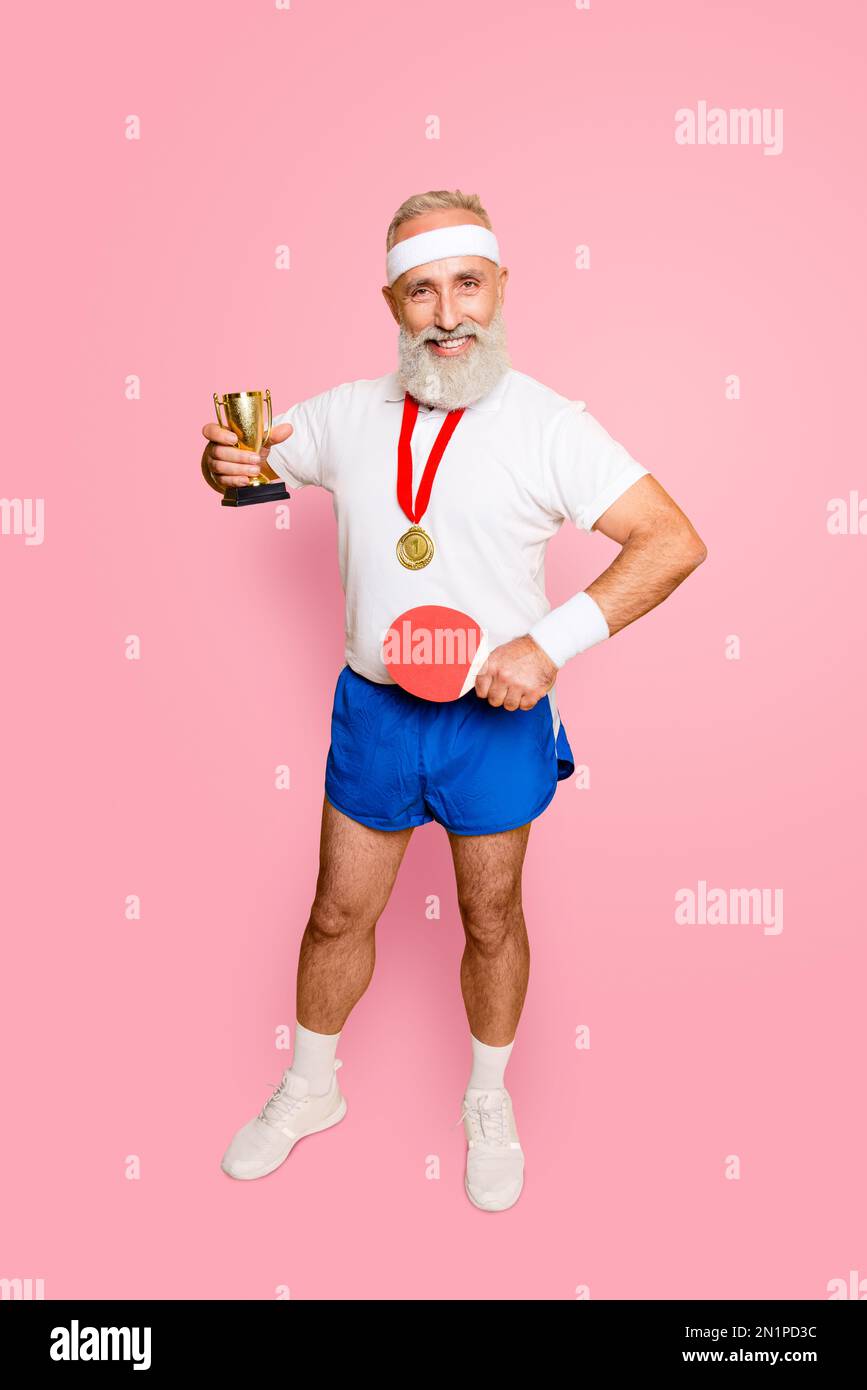 Competetive cool healthy modern successful active grandpa with table ...