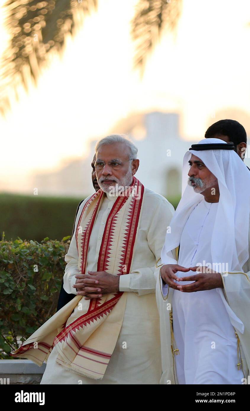 Indian Prime Minister Narendra Modi, left, walks with Sheikh Hamdan bin ...