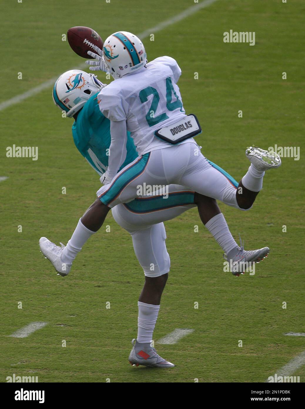 Miami Dolphins cornerback Brice McCain (24) breaks up a pass intended ...