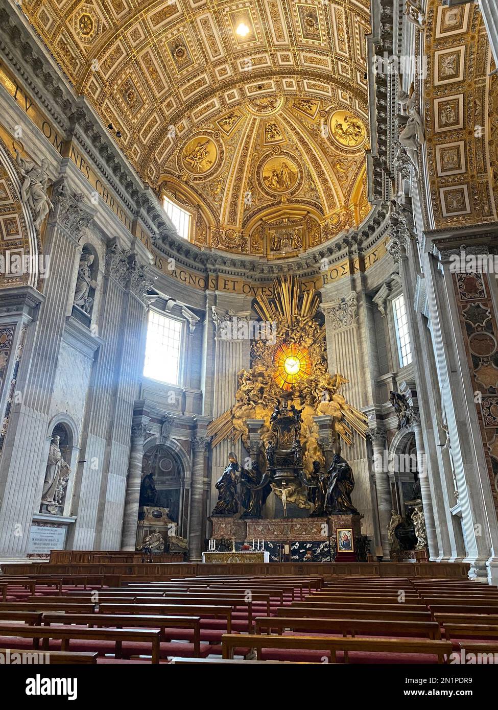 A vertical shot of the altar of St.Peter's Basilica in Vatican City ...