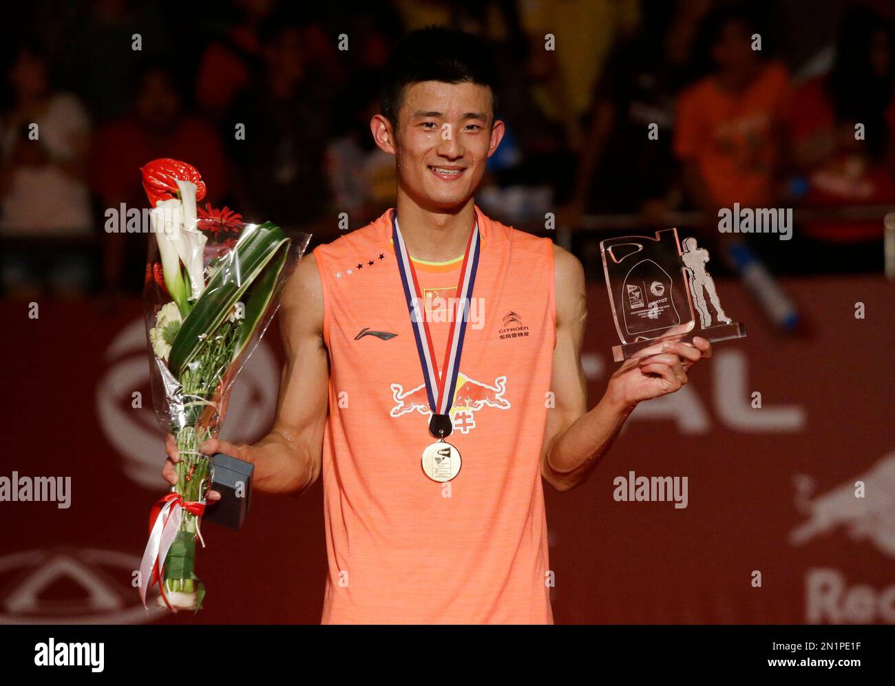 China's Chen Long poses with his gold medal for a photo during an award ...
