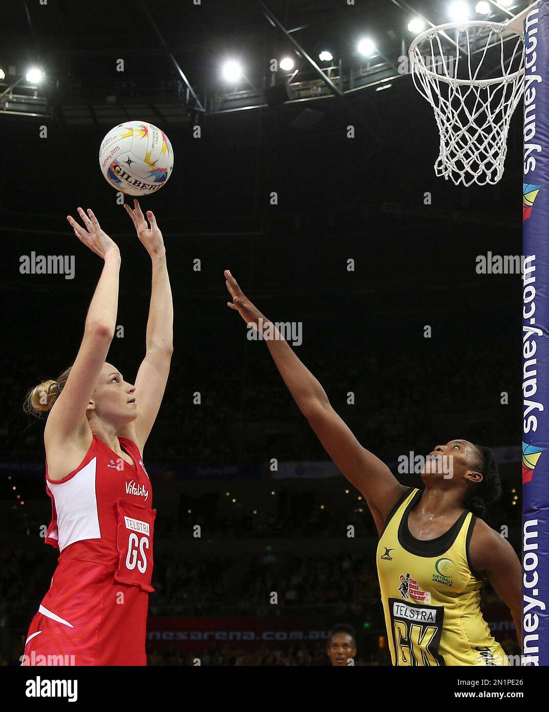 England's Joanne Harten, left, throws a shot as Jamaica's Stacian Facey ...