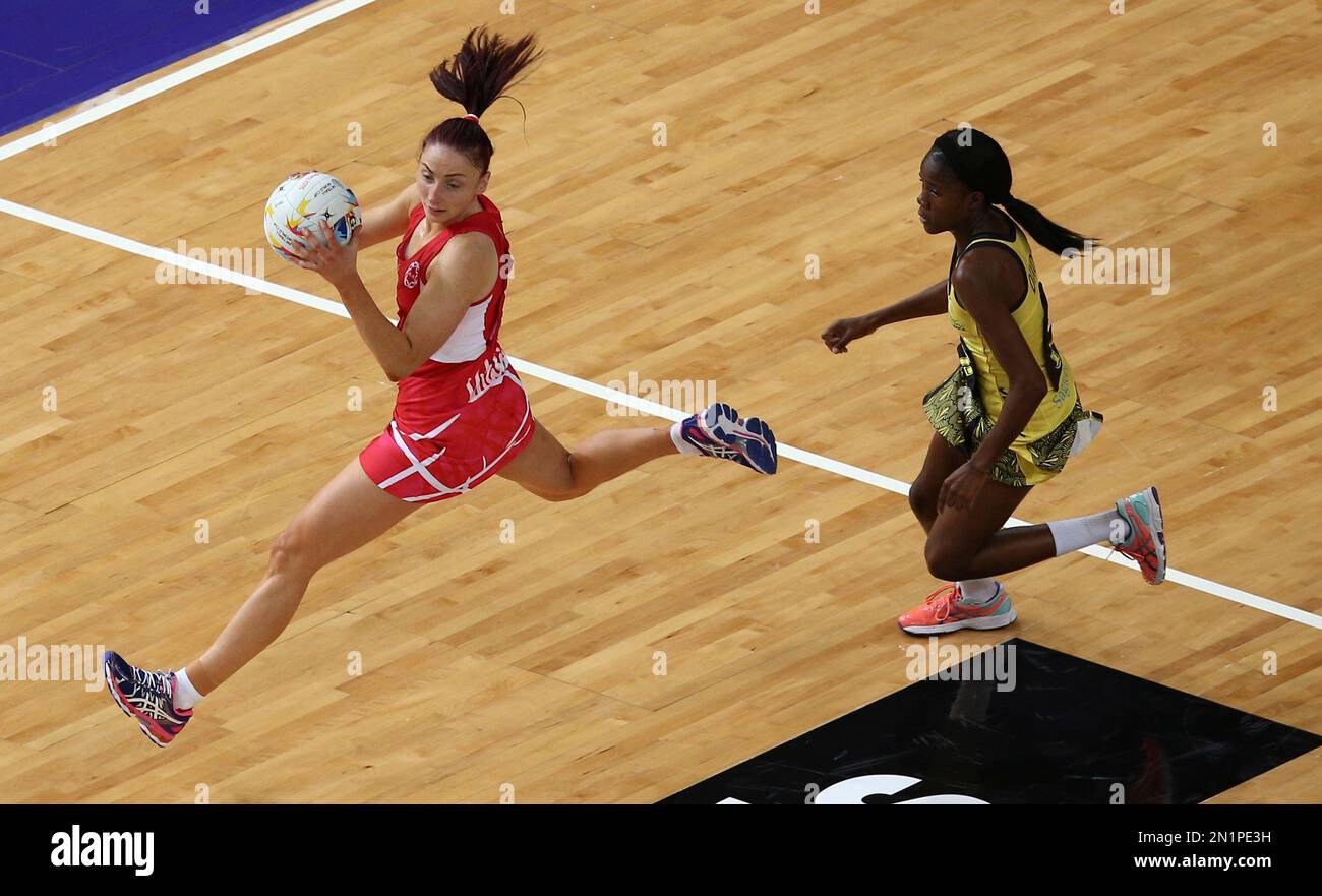England's Jade Clarke, left, catches the ball as Jamaica's Nicole Dixon ...