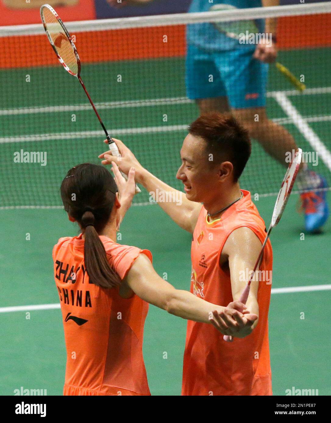 China's Zhang Nan, right, and his partner Zhao Yunlei celebrate after ...