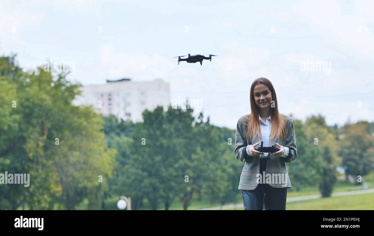 Asian female flying a drone hi-res stock photography and images - Alamy