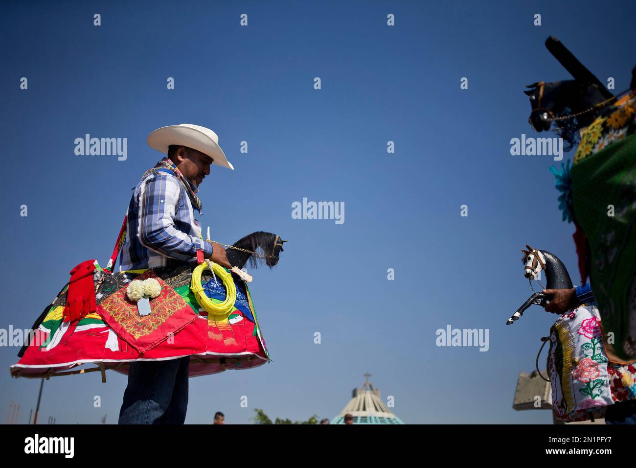 A dancer from Tula wears a traditional costume as he stands in the ...