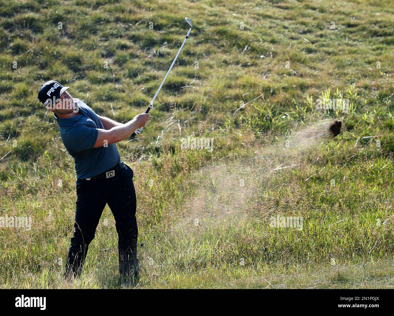 David Lingmerth, of Sweden, hits from the rough on the sixth hole ...