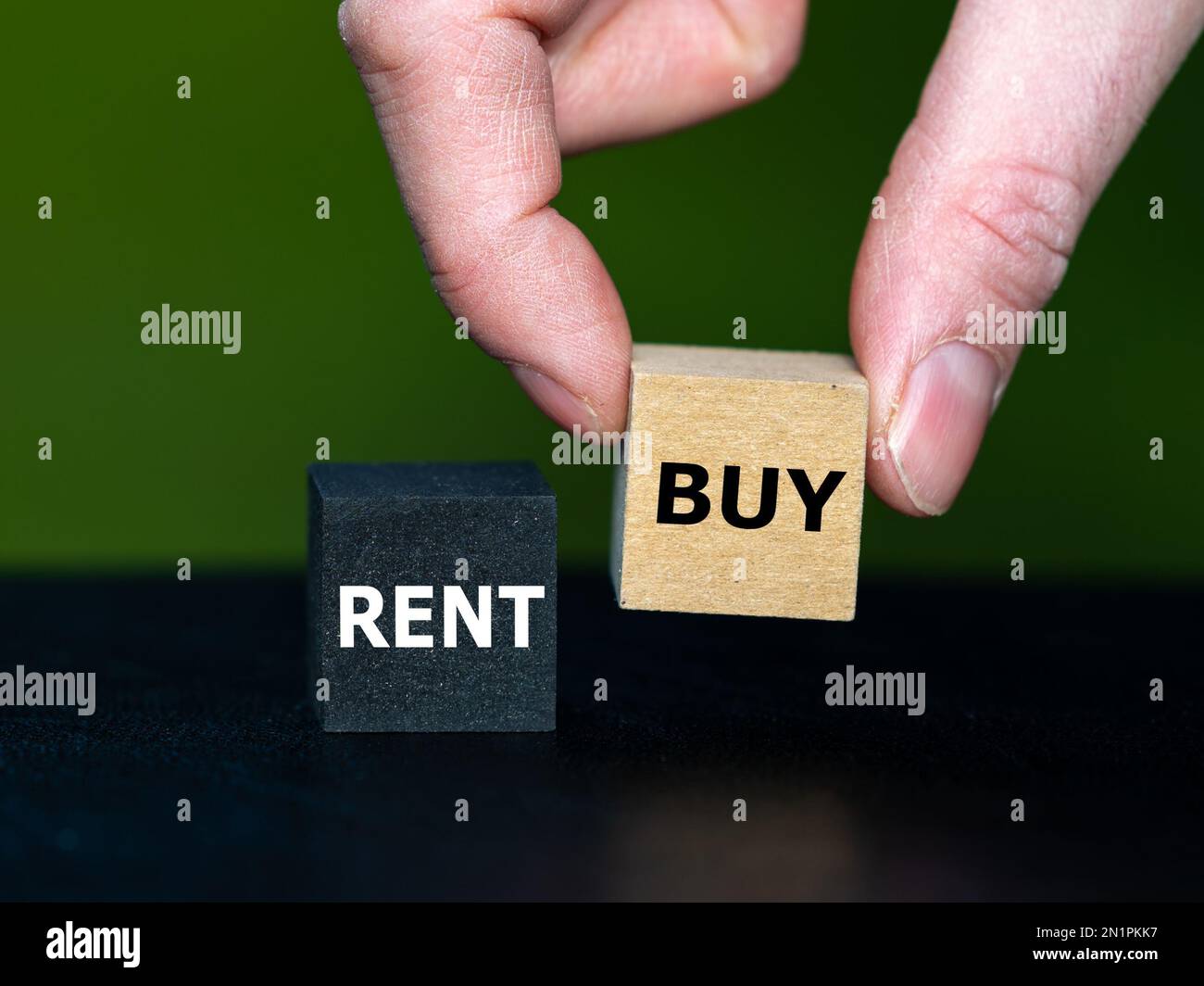 Hand Selects The Cube With The Word Buy Instead Of The Cube With The Word Buy Symbol For Buying