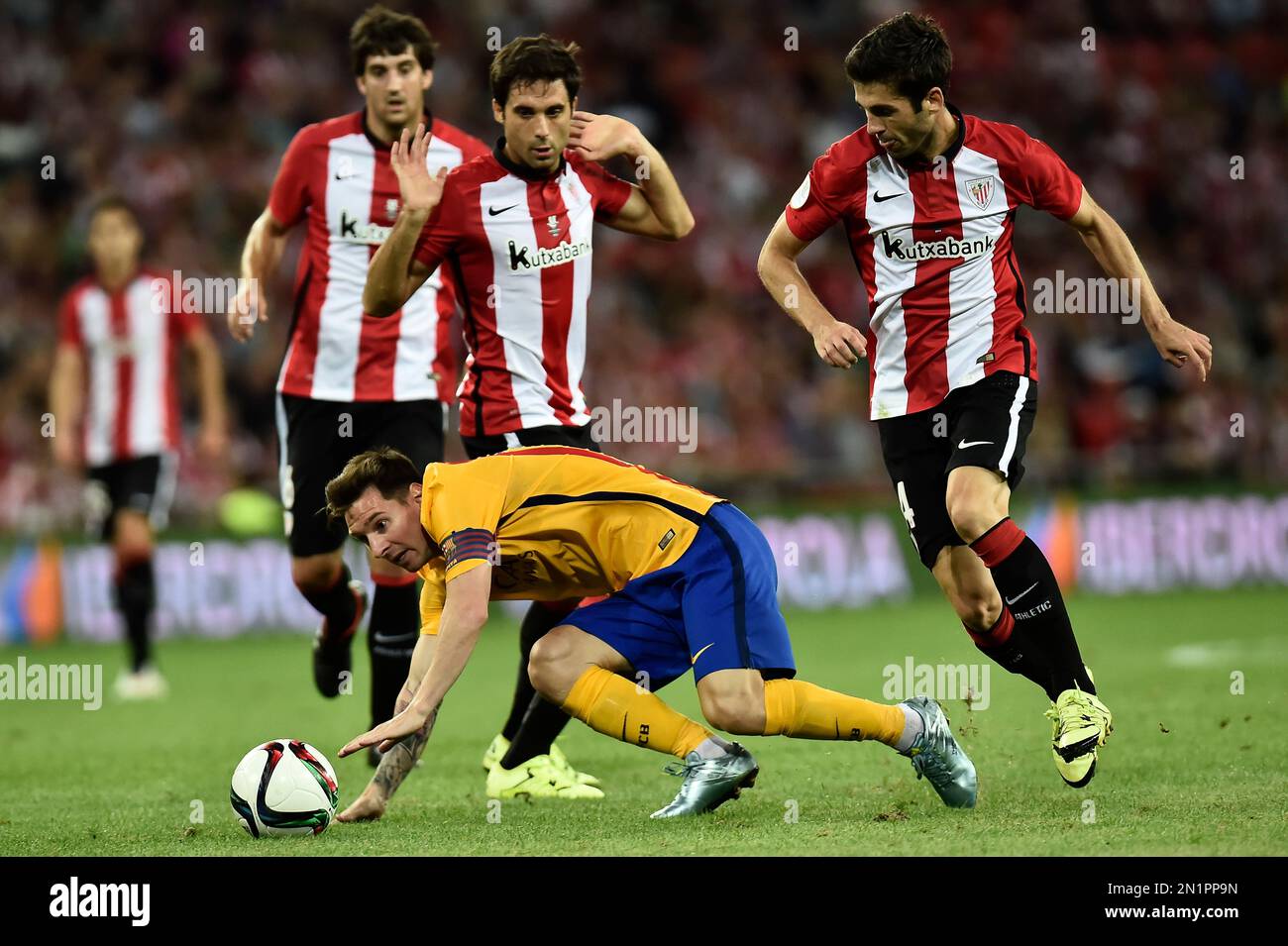FC Barcelona's Lionel Messi of Argentina, center, duels for the ball ...