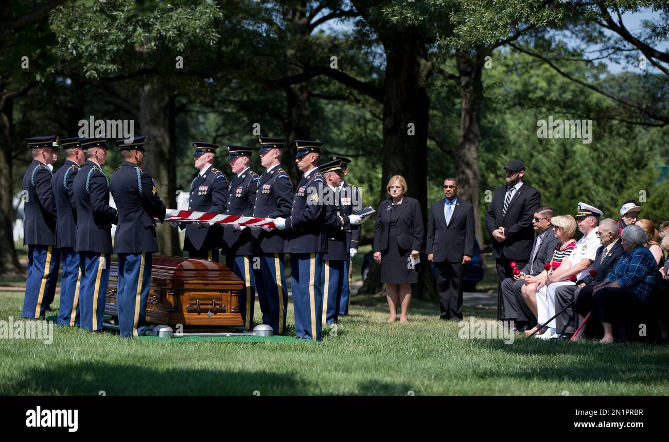 The flag is lifted from the casket of U.S. Army Air Force 2nd Lt ...