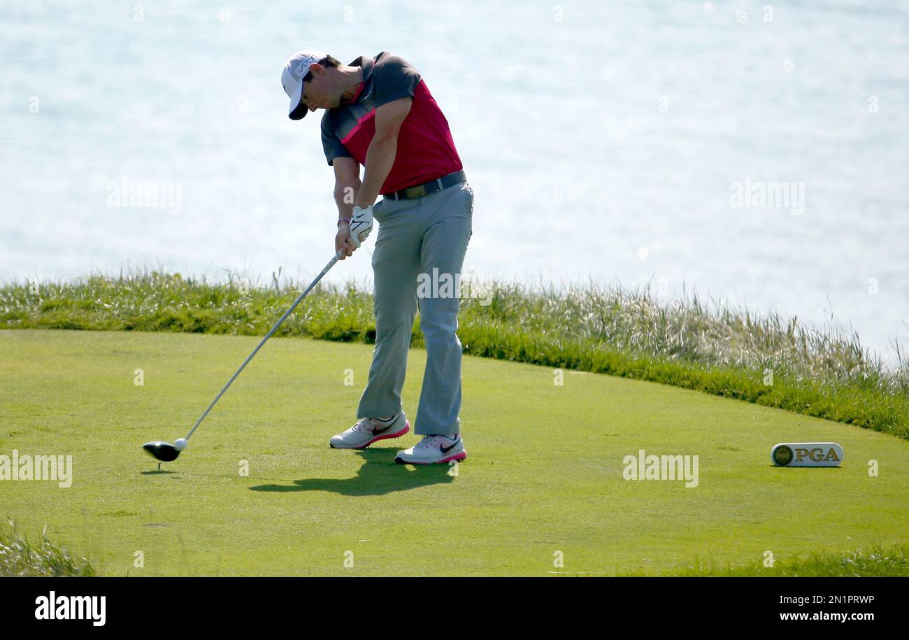 Rory McIlroy, of Northern Ireland, hits a tee shot on the 18th hole ...