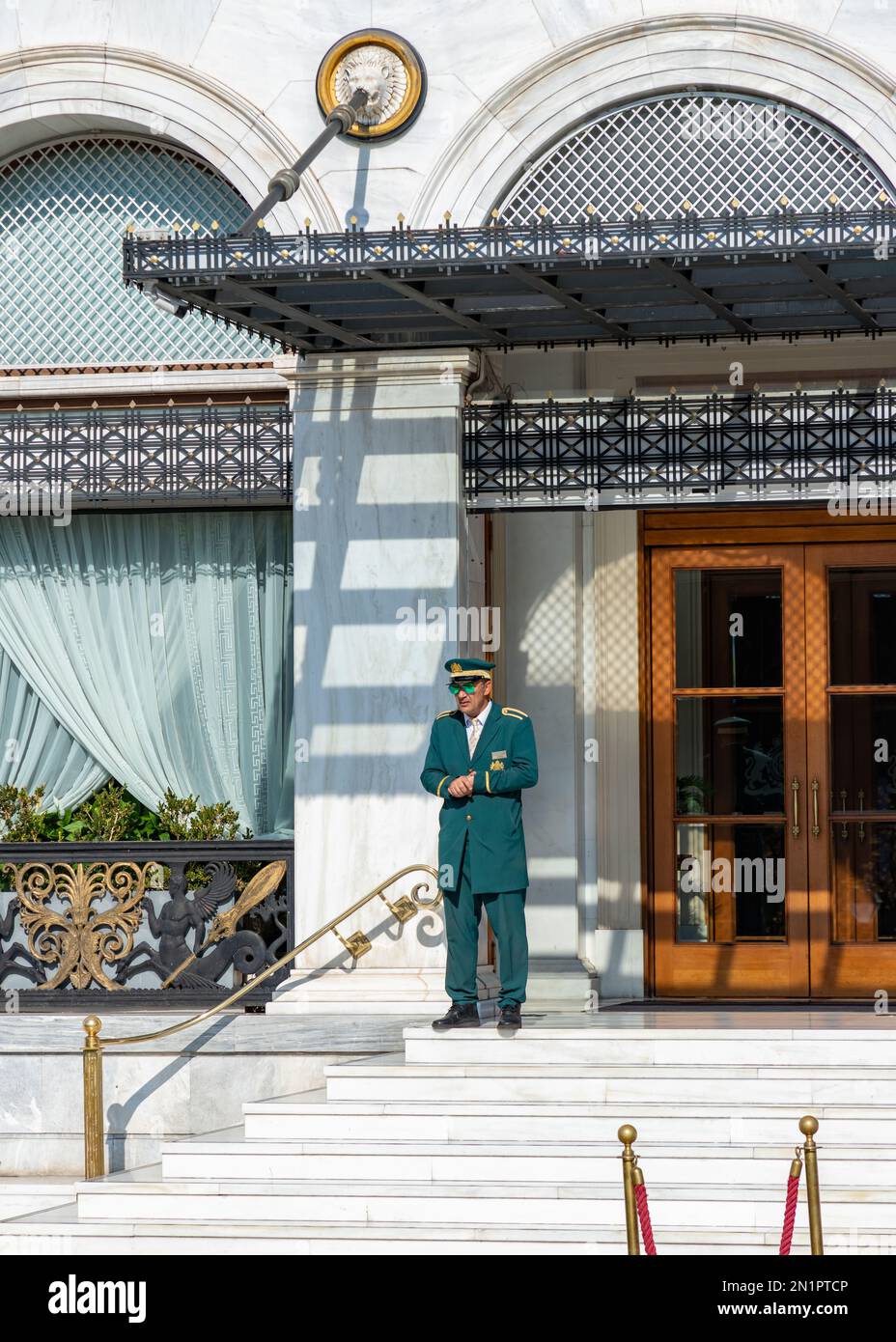 A picture of a doorman in front of a hotel Stock Photo - Alamy