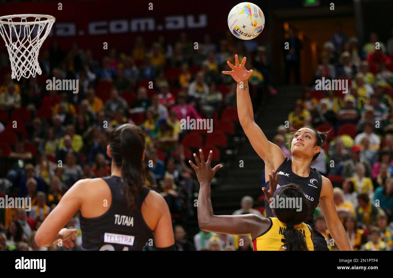 New Zealand's Malia Paseka, right, jumps up high as Uganda's Alice ...