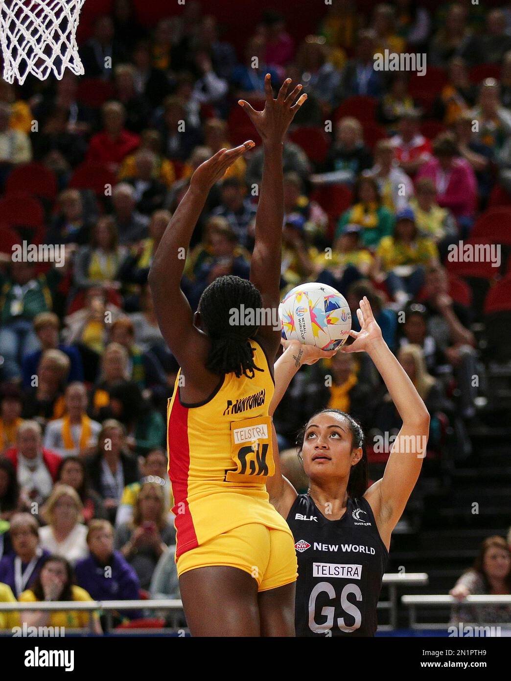 New Zealand's Malia Paseka, right, shoots for goal as Uganda's Alice ...
