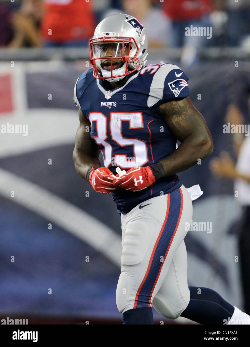 New England Patriots running back Jonas Gray (35) runs off the field in ...