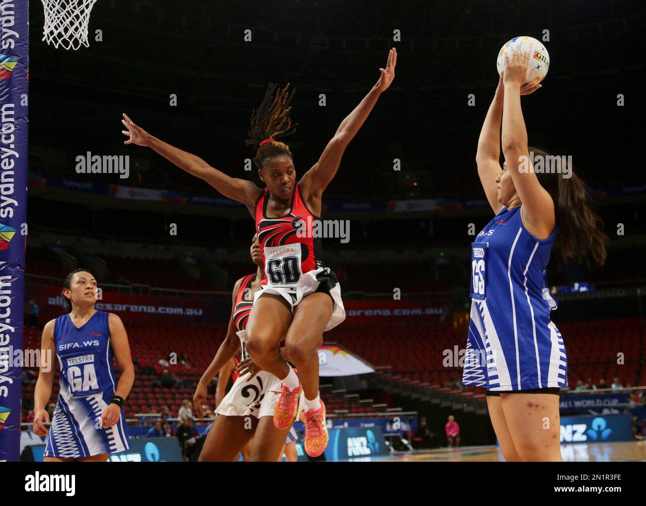 Trinidad and Tobago's Kielle Connelly, left, jumps high to try and ...