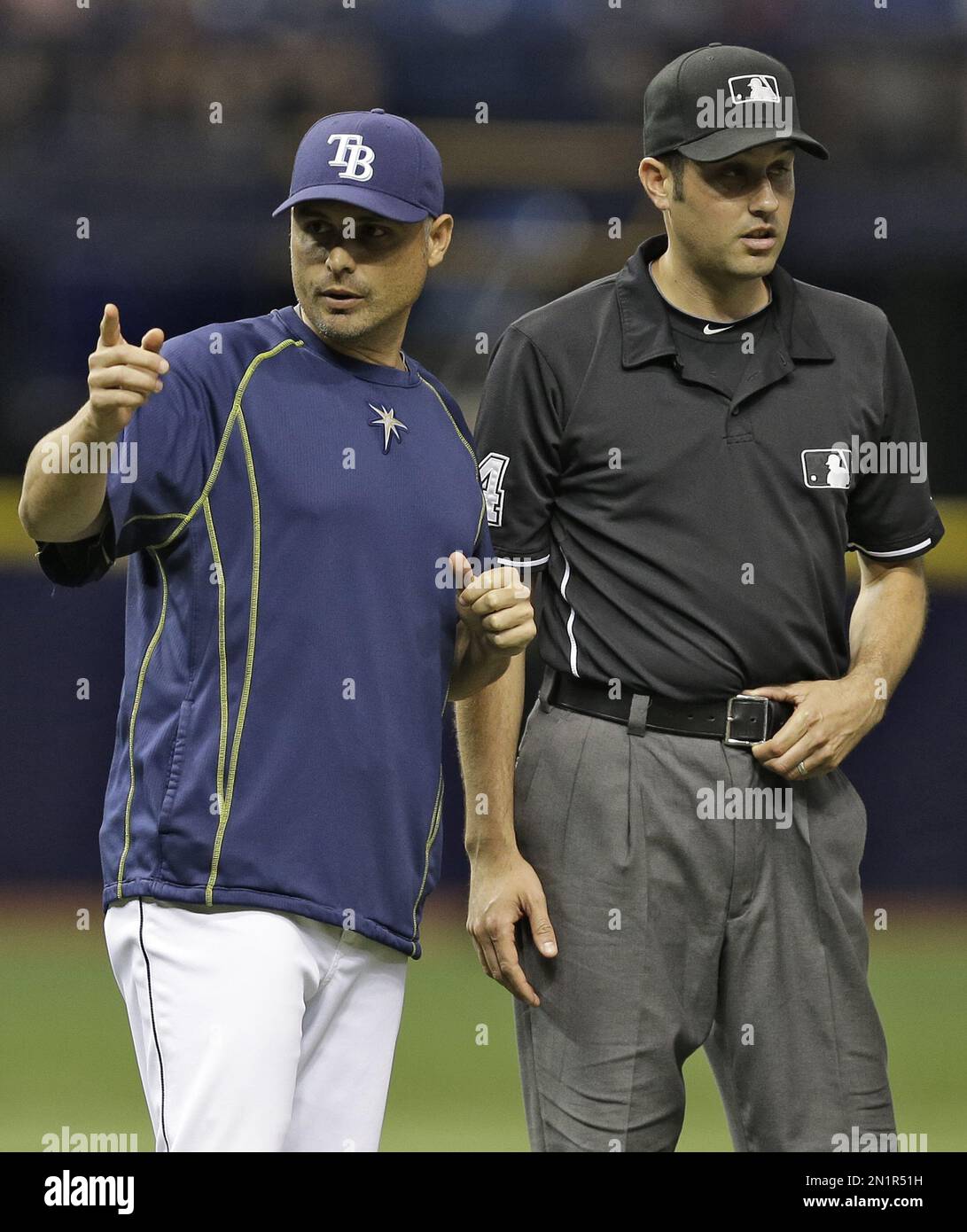 Tampa Bay Rays manager Kevin Cash, right, asks umpire John Tumpane to ...
