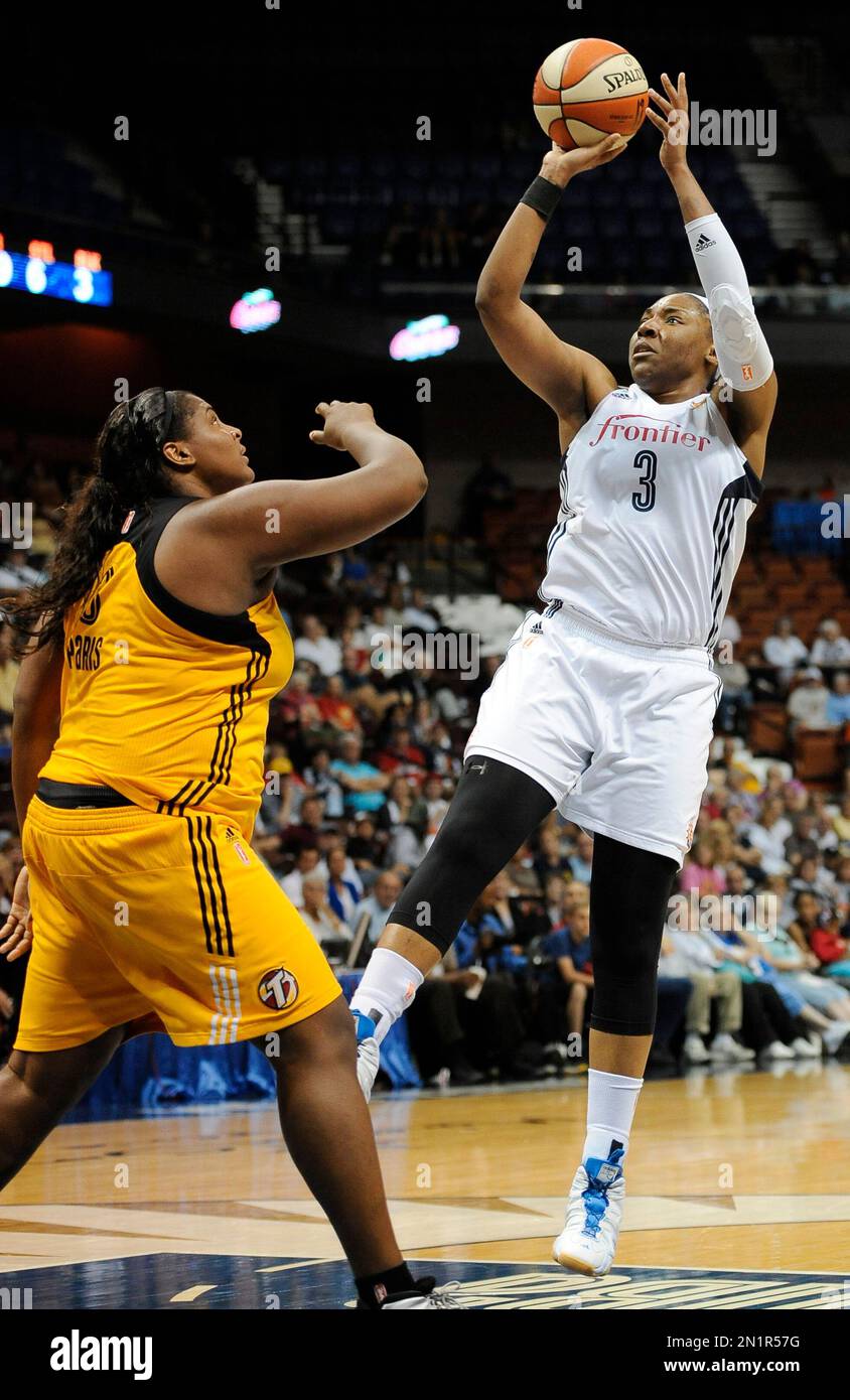 Connecticut Sun’s Kelsey Bone, right, shoots over Tulsa Shock’s ...