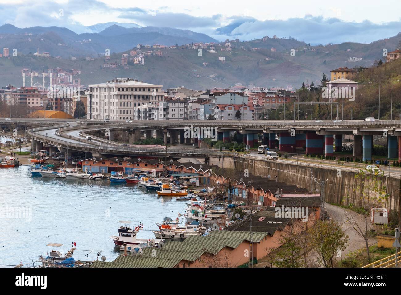 Coastal view with fishing harbor and highway overpass of Arakli ...