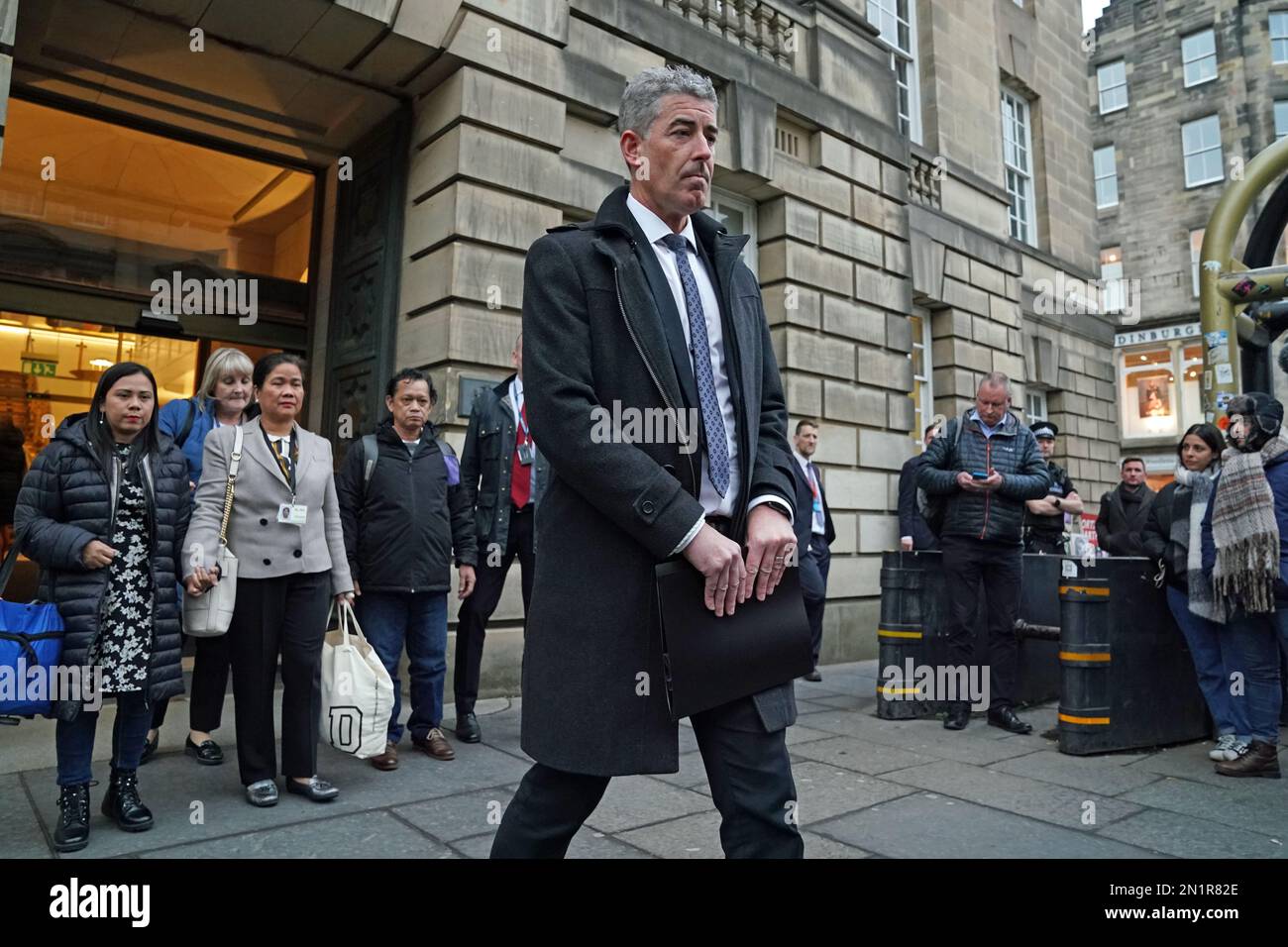 DCI Graham Smith from Police Scotland (centre) outside Edinburgh High ...