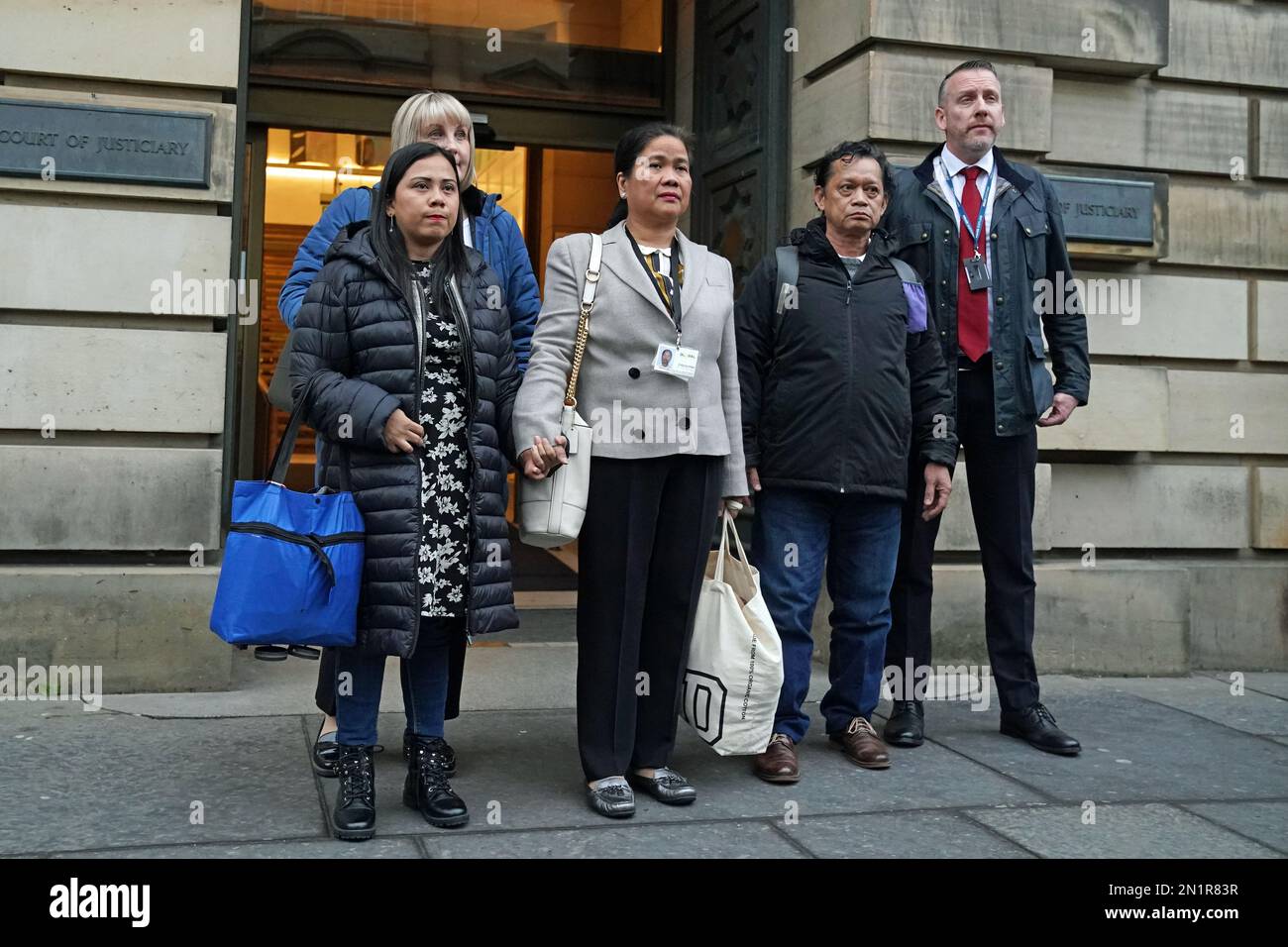 Family members of Bennylyn Burke, sister Shela Aquino (left) and father ...